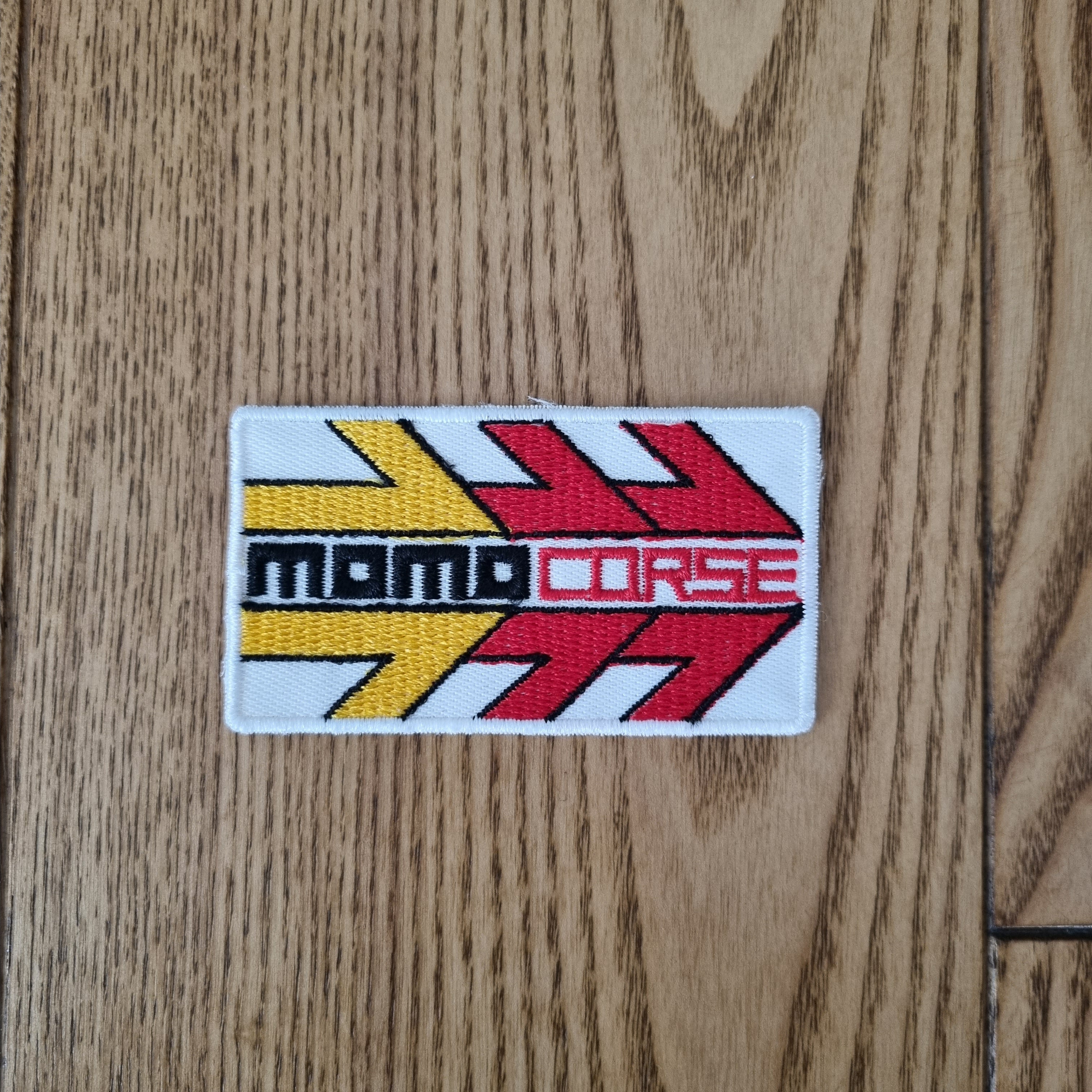Logotipo De Momo Corse 27 IMSA Images , Bicentennial Park (1990)